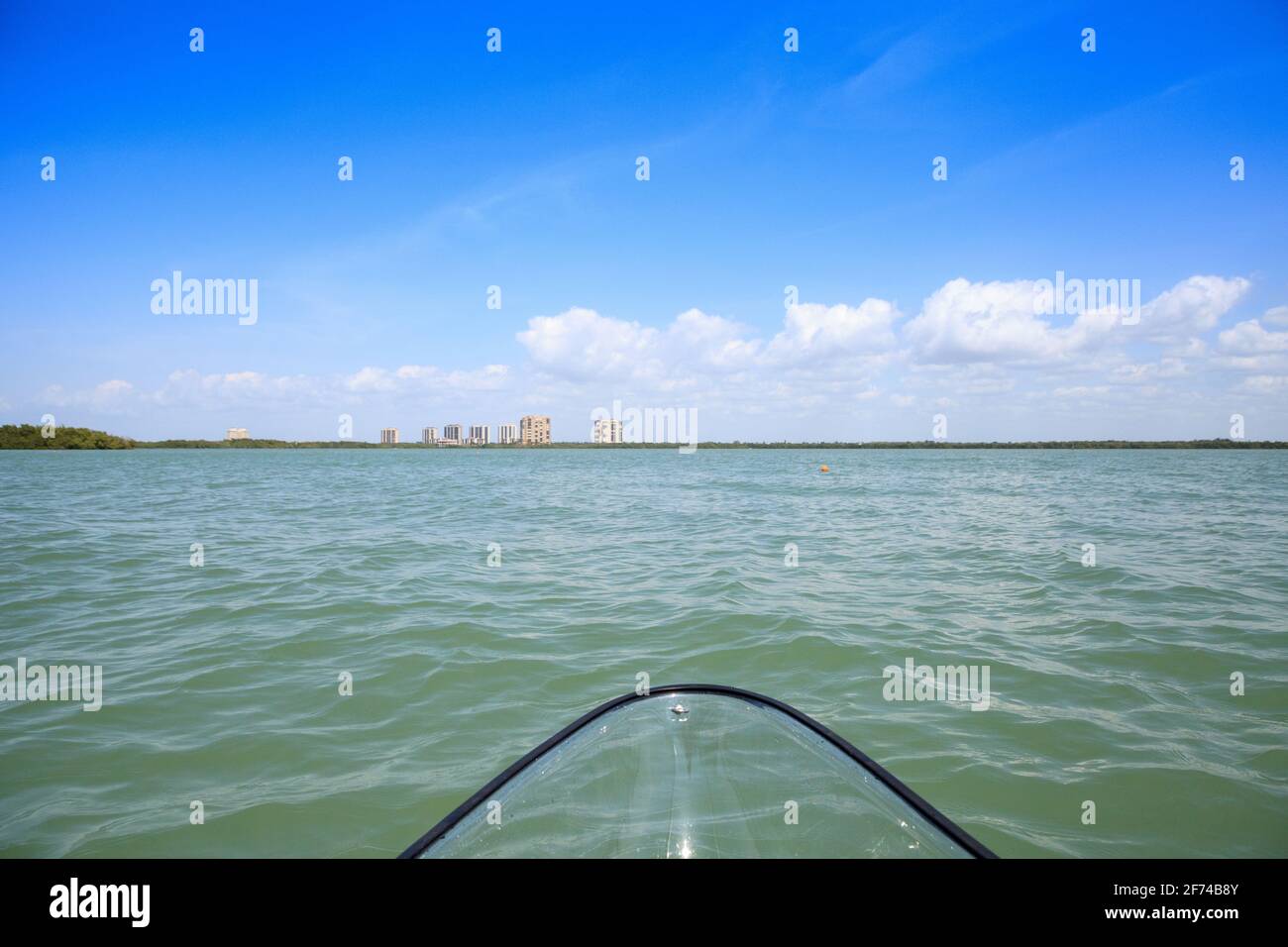 Clear kayak forges through the waterway of Lovers Key in Bonita Springs ...