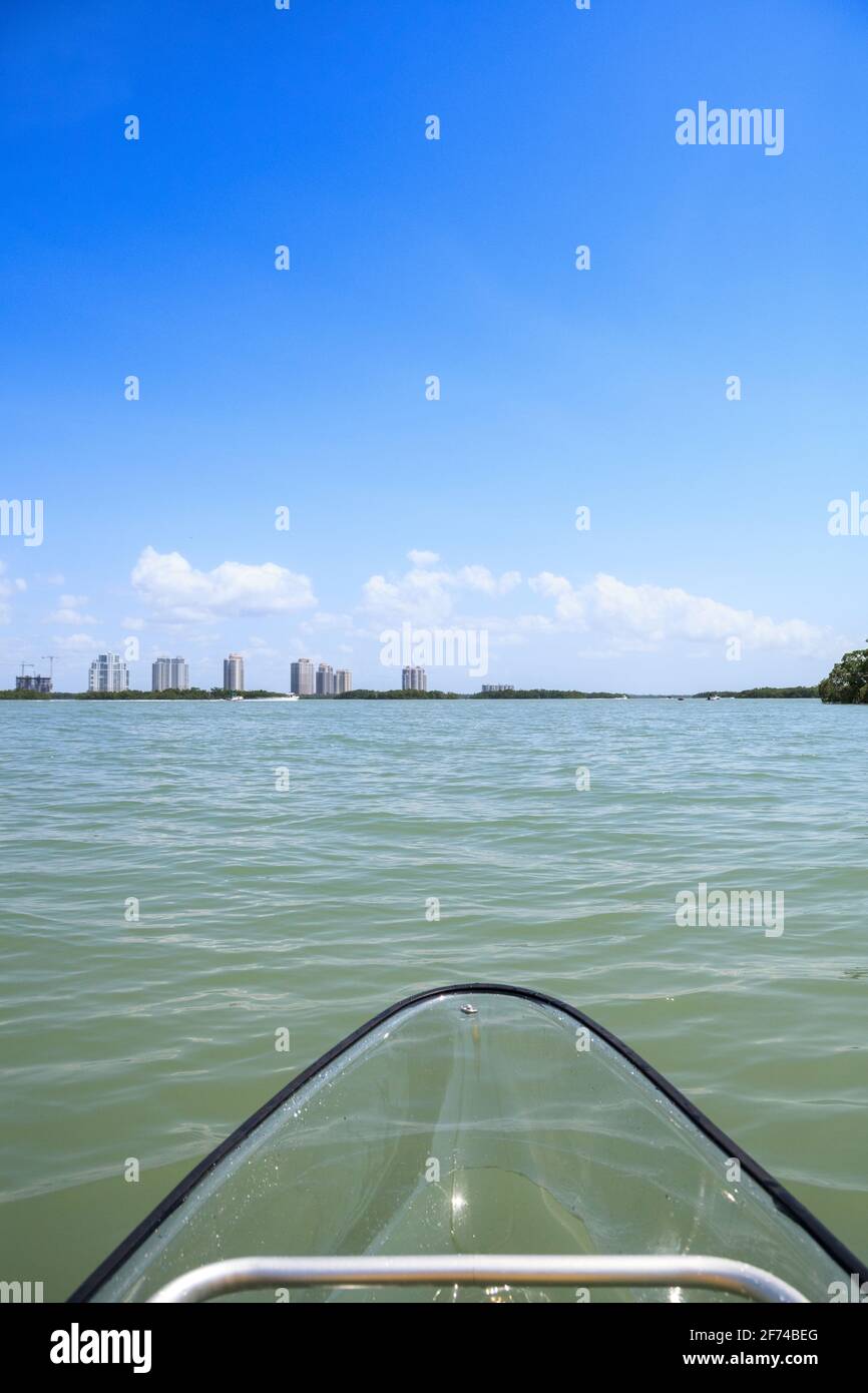 Clear kayak forges through the waterway of Lovers Key in Bonita Springs ...