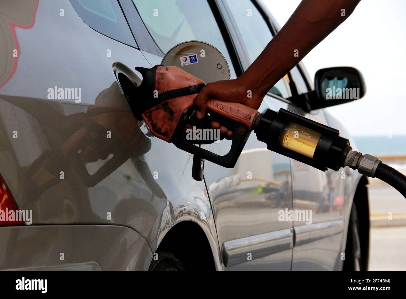 salvador, bahia / brazil - december 10, 2012: gas station attendant is ...