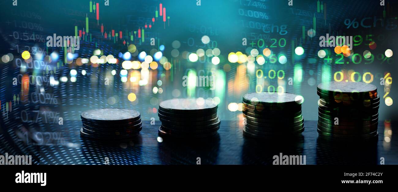 stack of money coin and blur green blue city light and index number of ...