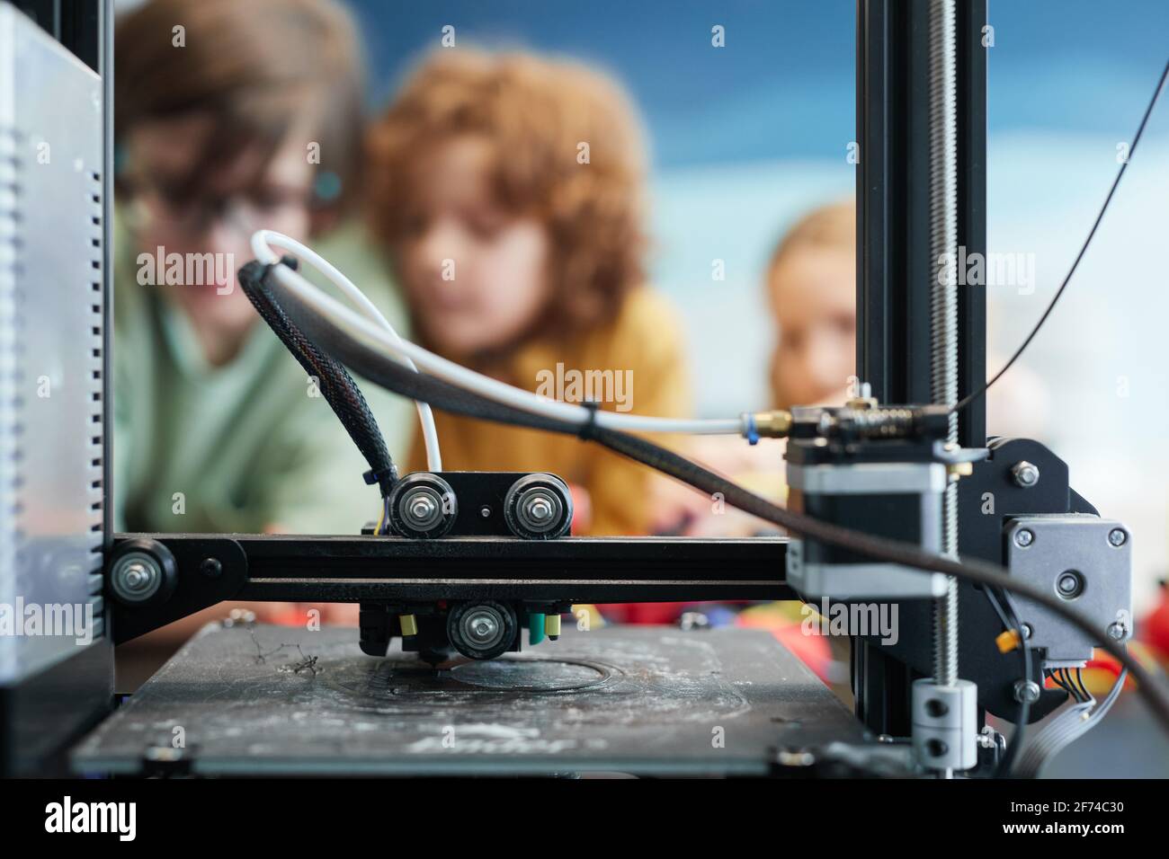 Close up of 3D printer making plastic models during engineering and ...