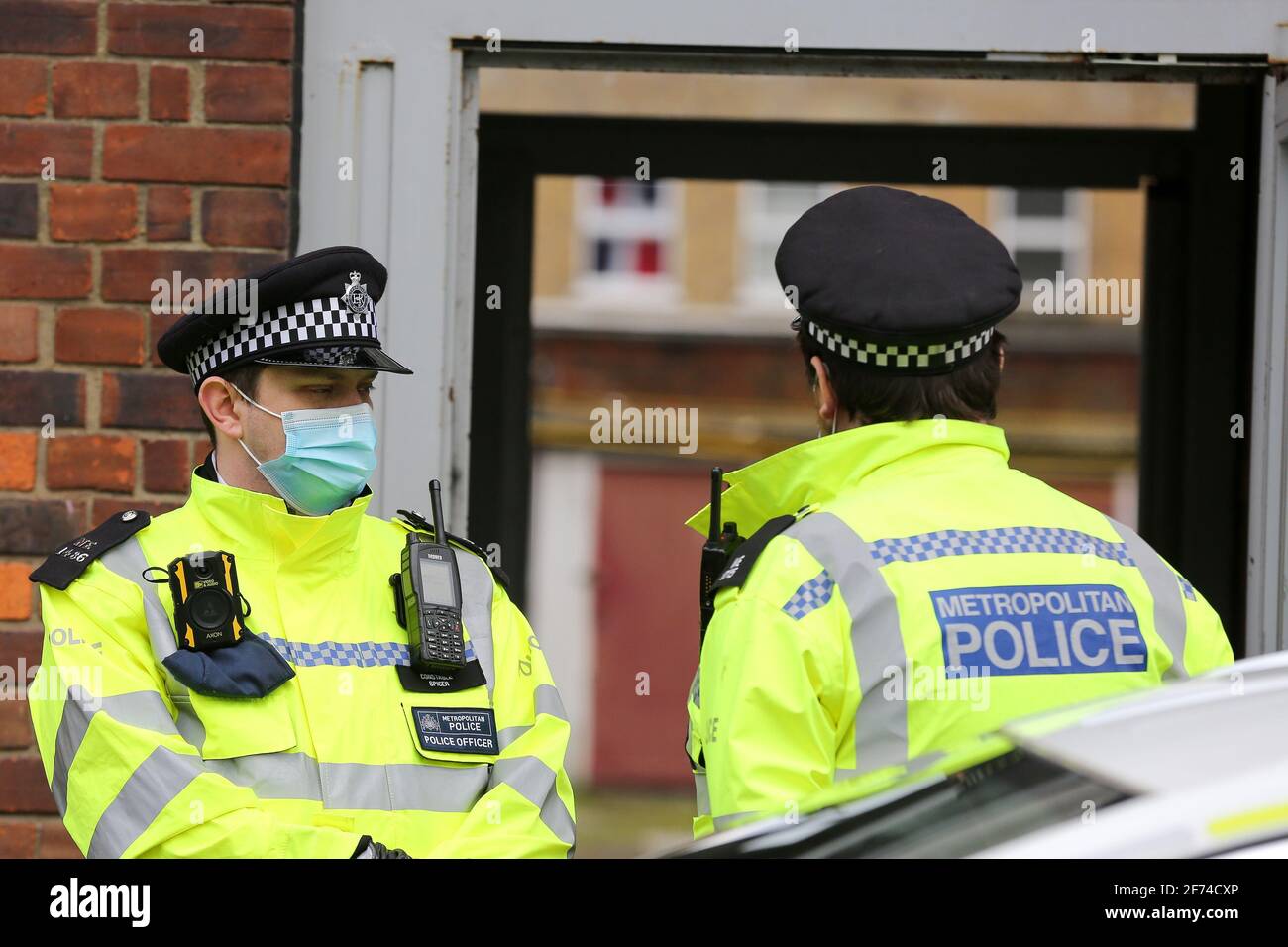 Police officers are seen standing alert in London Stock Photo - Alamy