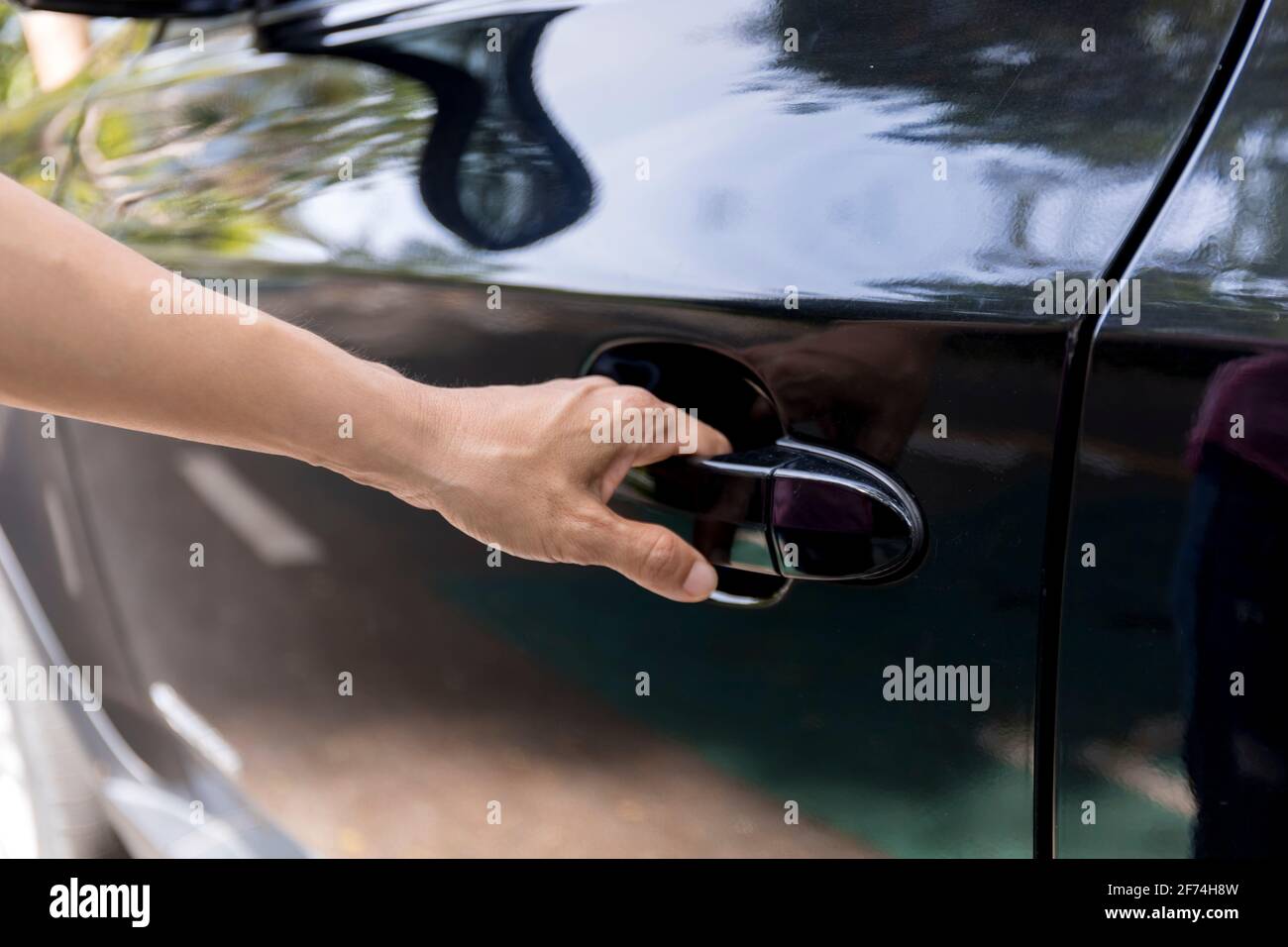 Hand on handle hi-res stock photography and images - Alamy