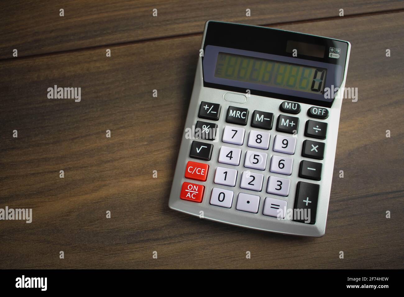Calculator in office on empty wooden table. Concept of financial ...