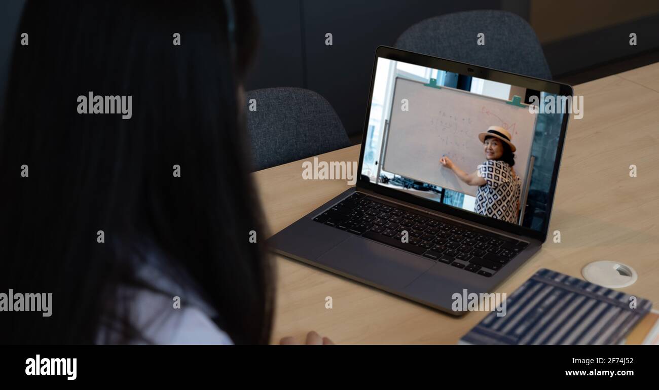 Asian young girl student learning virtual internet online class from ...