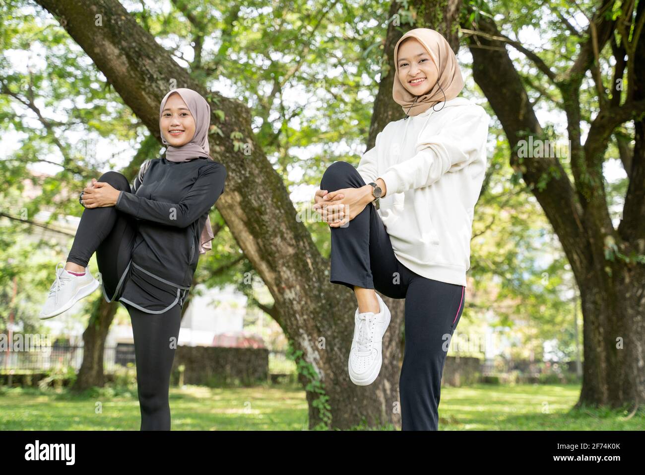 muslim with exercising partner doing sport together outdoor Stock Photo ...