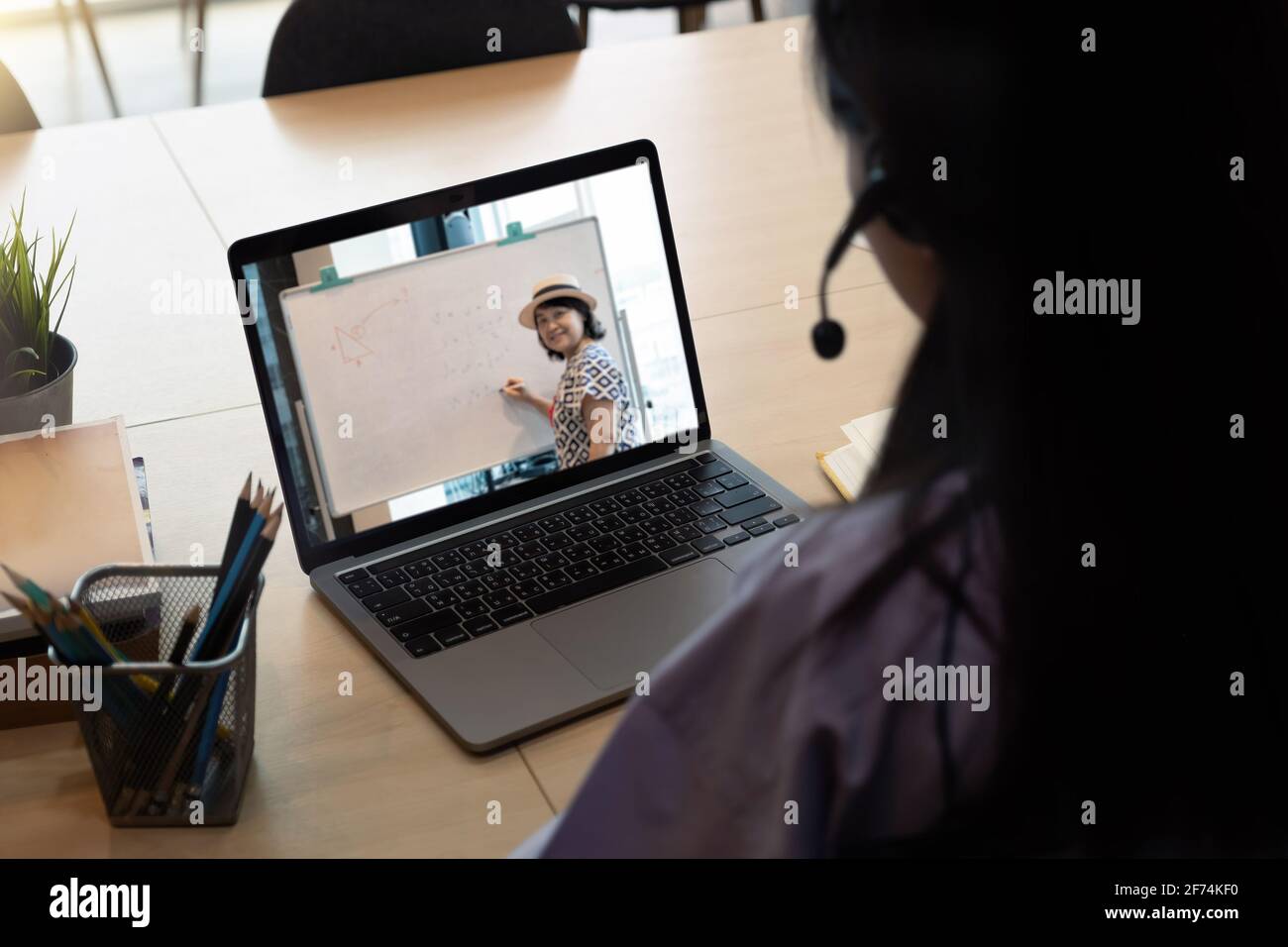 Asian young girl student learning virtual internet online class from ...