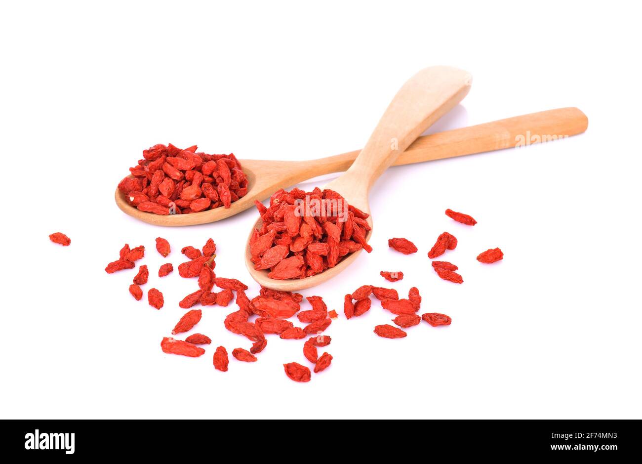 dry red goji berries in the spoon on white background Stock Photo - Alamy