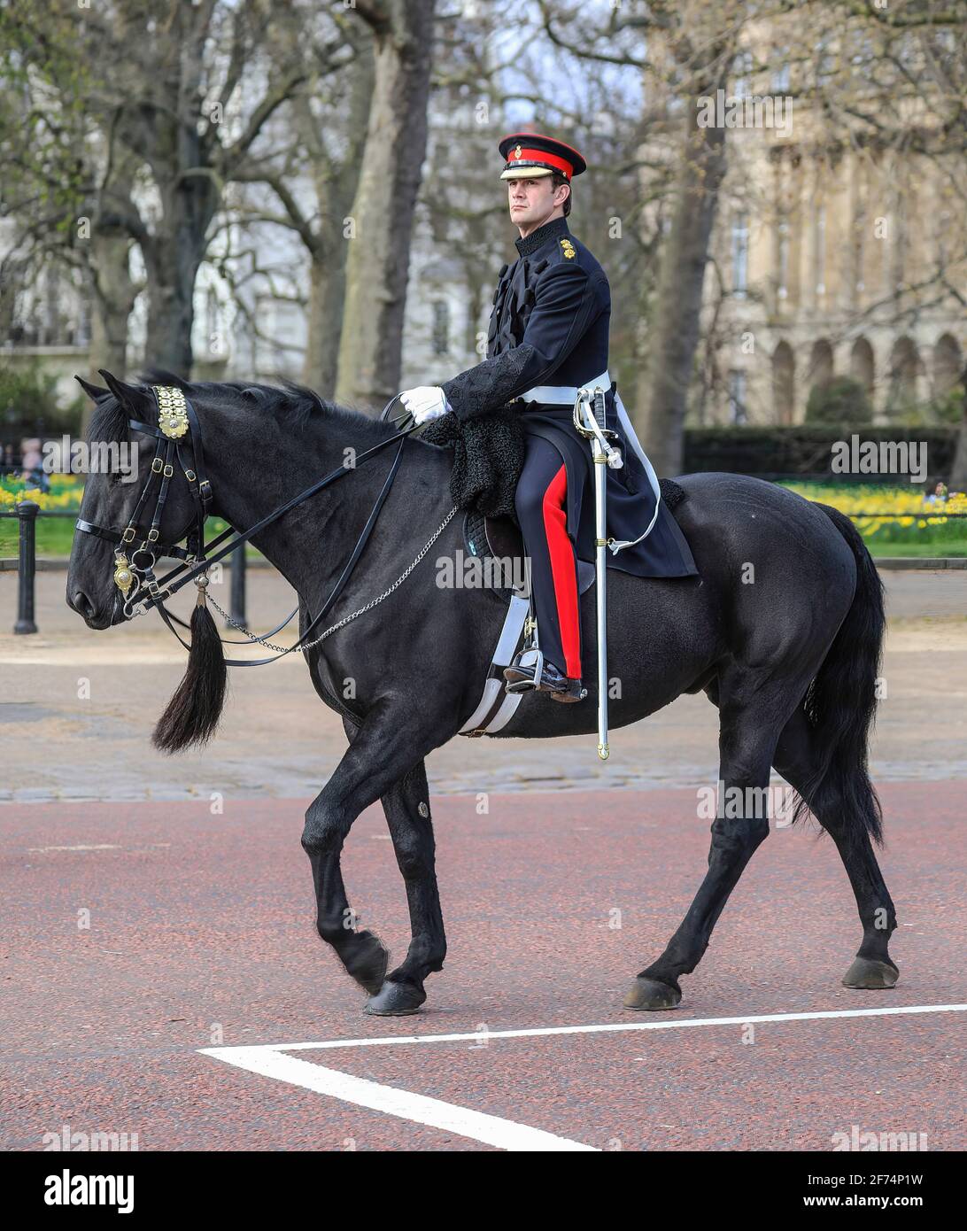 London, UK. 2nd Apr, 2021. A guard seen riding a horse through St James ...