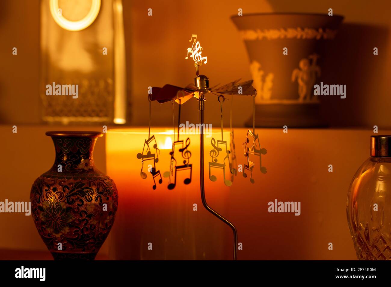 Abstract view of an interior fireplace mantel shelf of small candle lit ...