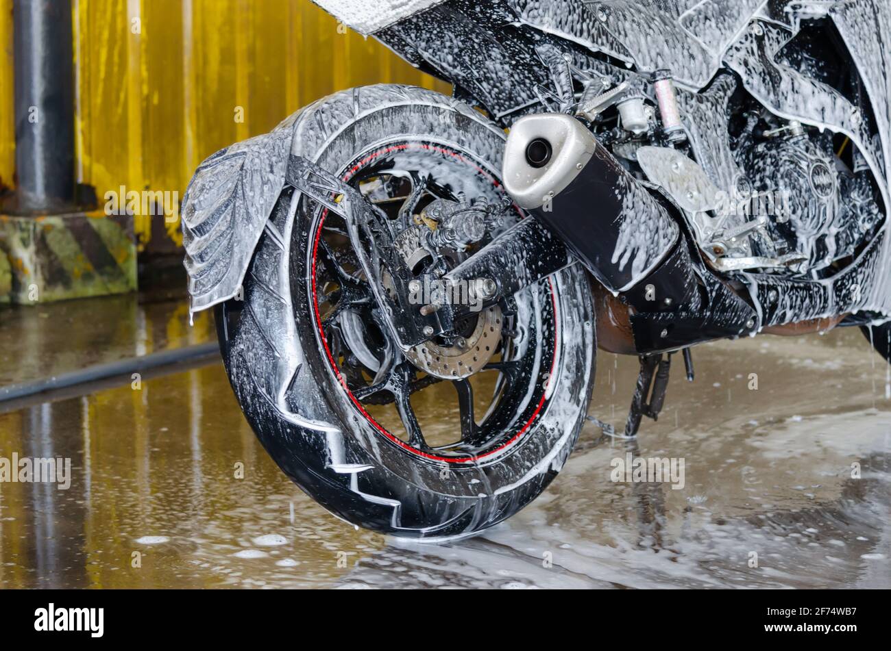 Clean up the motorcycle wash at the car wash shop Stock Photo - Alamy