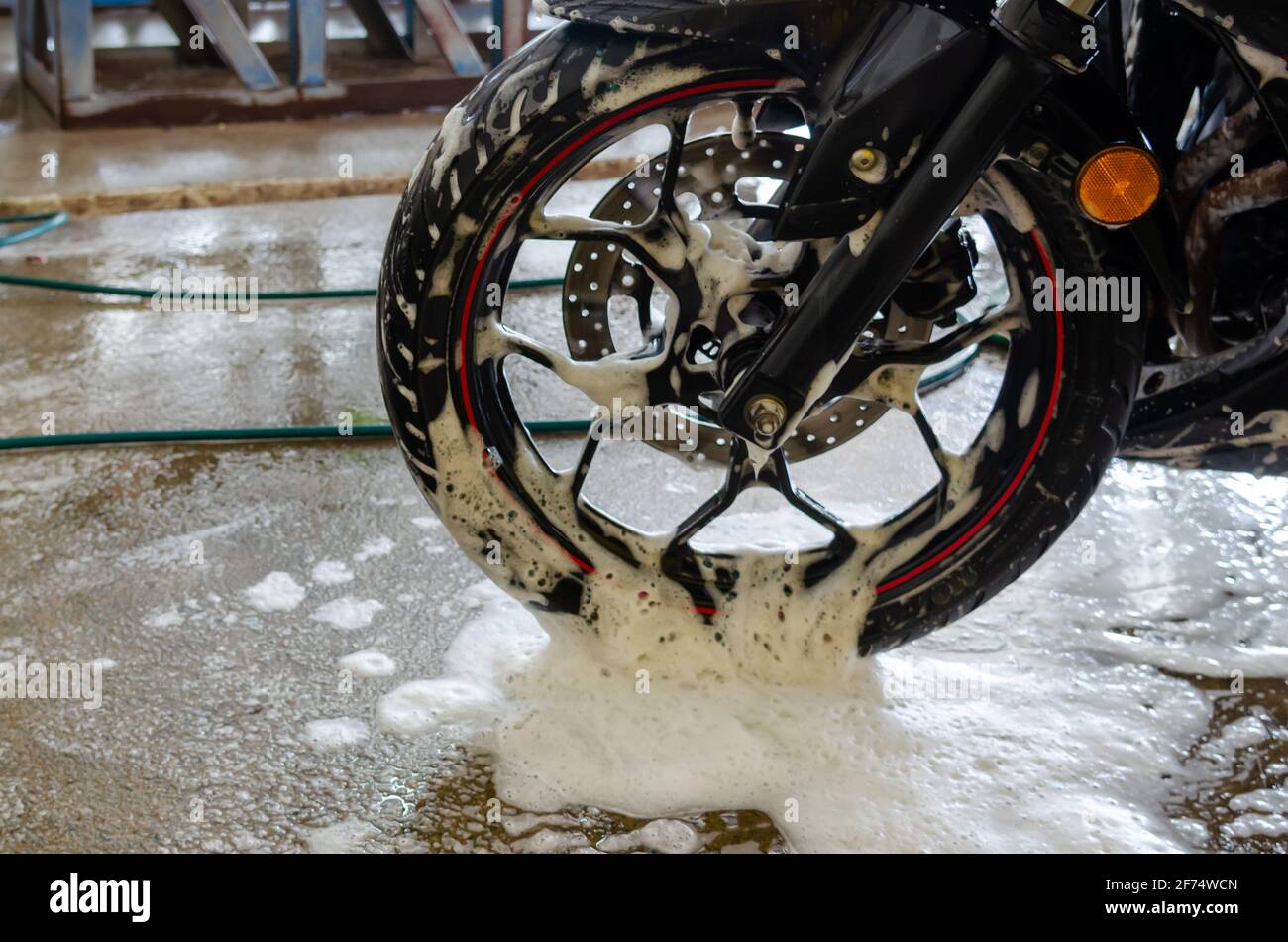 Clean up the motorcycle wash at the car wash shop Stock Photo - Alamy