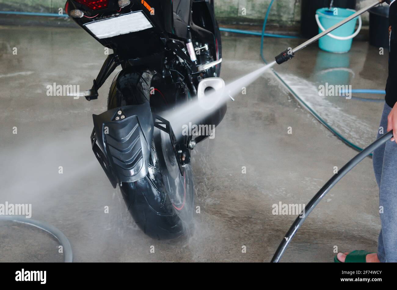 Clean up the motorcycle wash at the car wash shop Stock Photo - Alamy