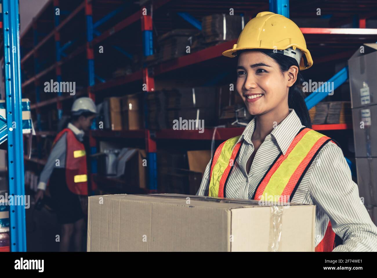Female warehouse worker working at the storehouse . Logistics , supply ...