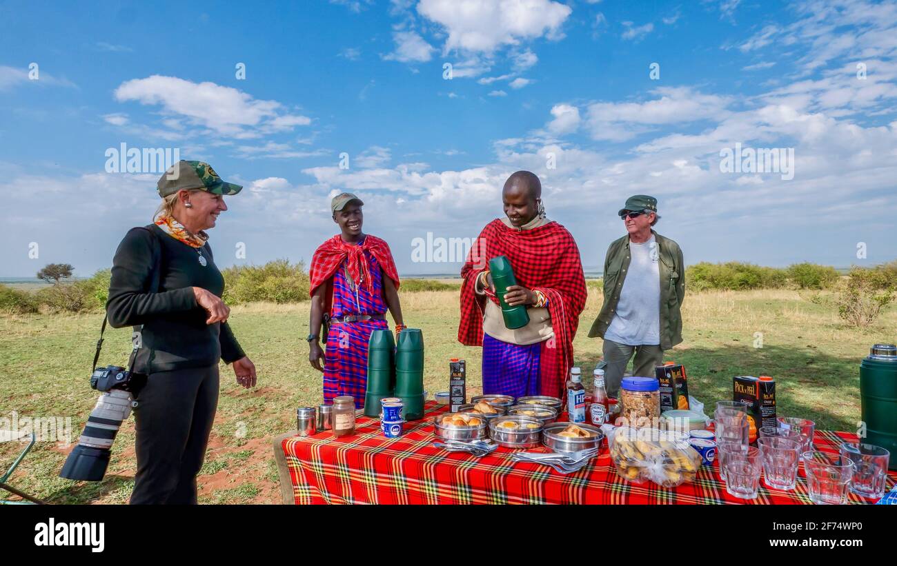 Masai Mara, Kenya - September 27, 2013. Masai safari guides wearing ...