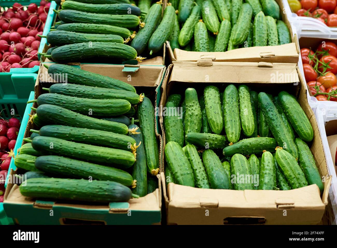 Boxes of cucumbers on a shelf in a supermarket Stock Photo - Alamy