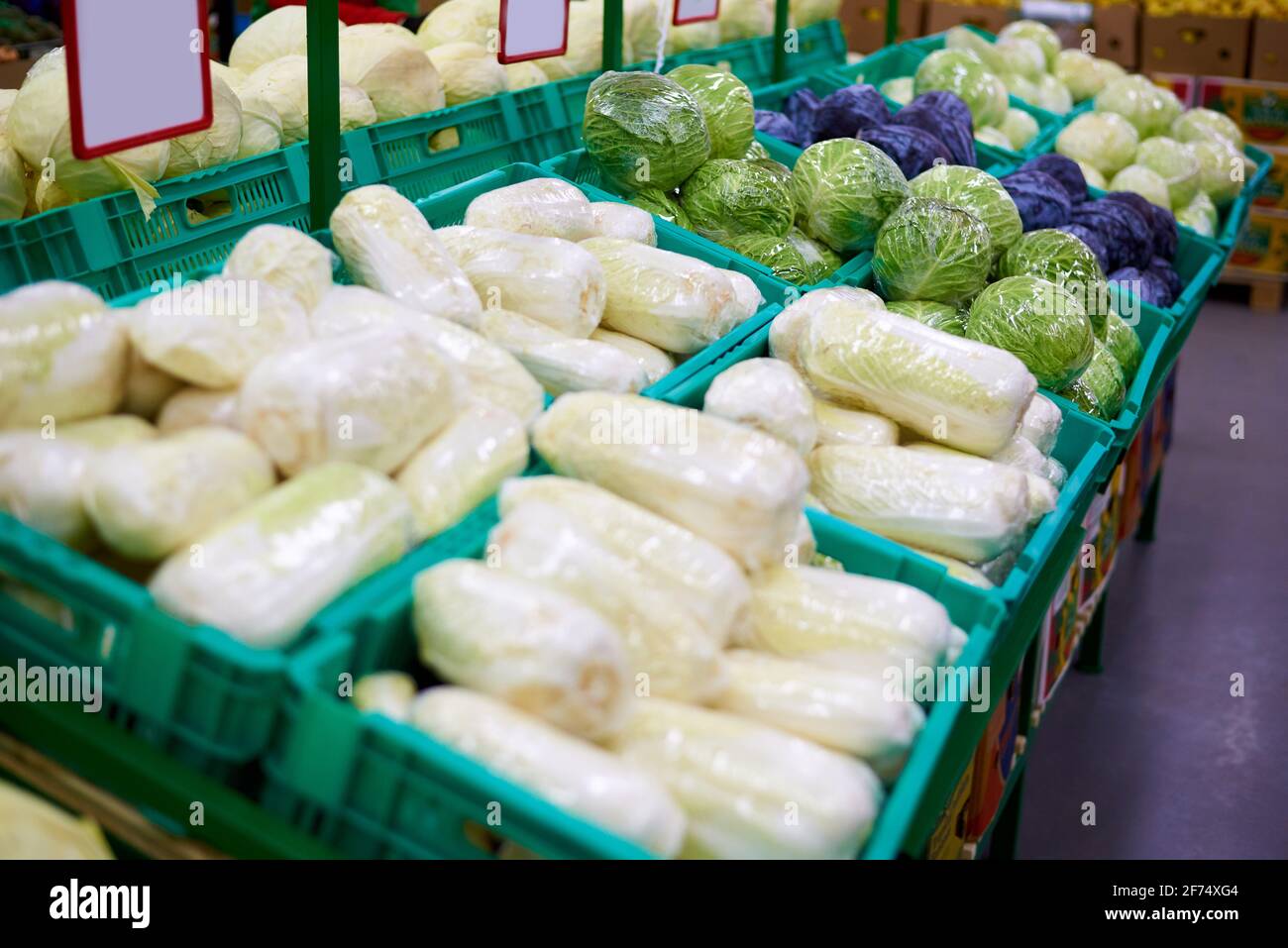 Cabbage in boxes on the shelves in the supermarket Stock Photo - Alamy