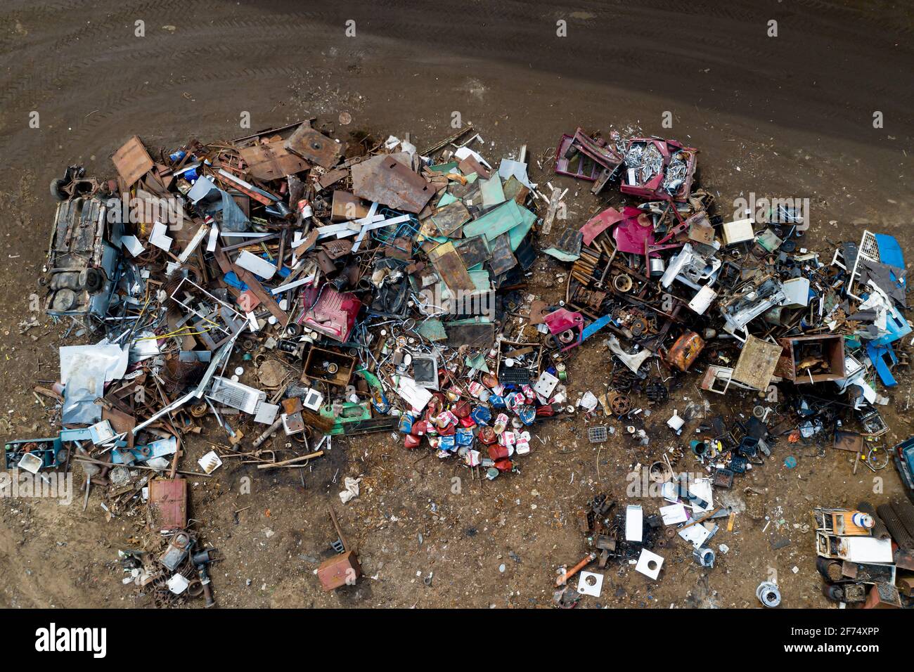 A pile of scrap metal on the ground top view. Secondary use of metal ...
