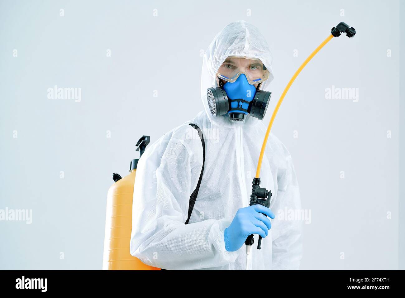 decontamination services worker wearing personal protective equipment ...