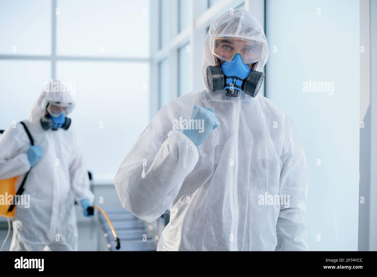 image of a confident disinfector standing in an office lobby Stock ...