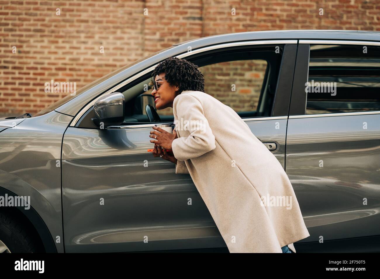 Attractive relaxed young female chilling in outdoor swimming pool with ...