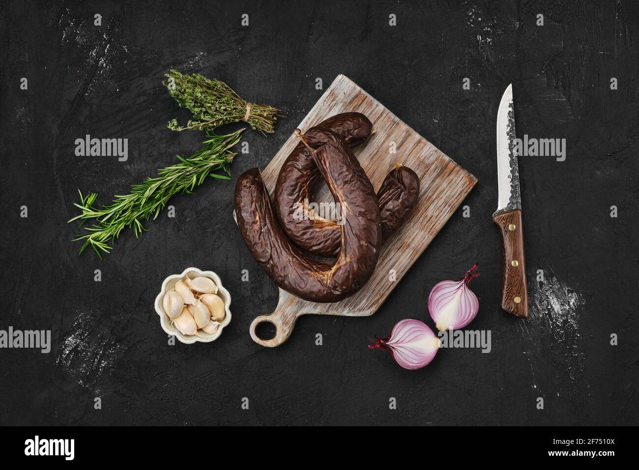 Overhead view of organic blood pudding on cutting board Stock Photo - Alamy