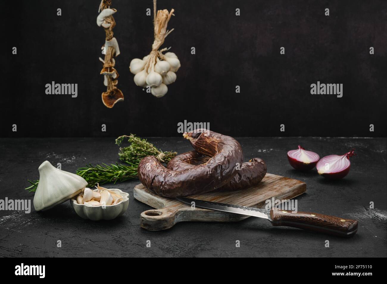 Organic blood pudding on cutting board Stock Photo - Alamy