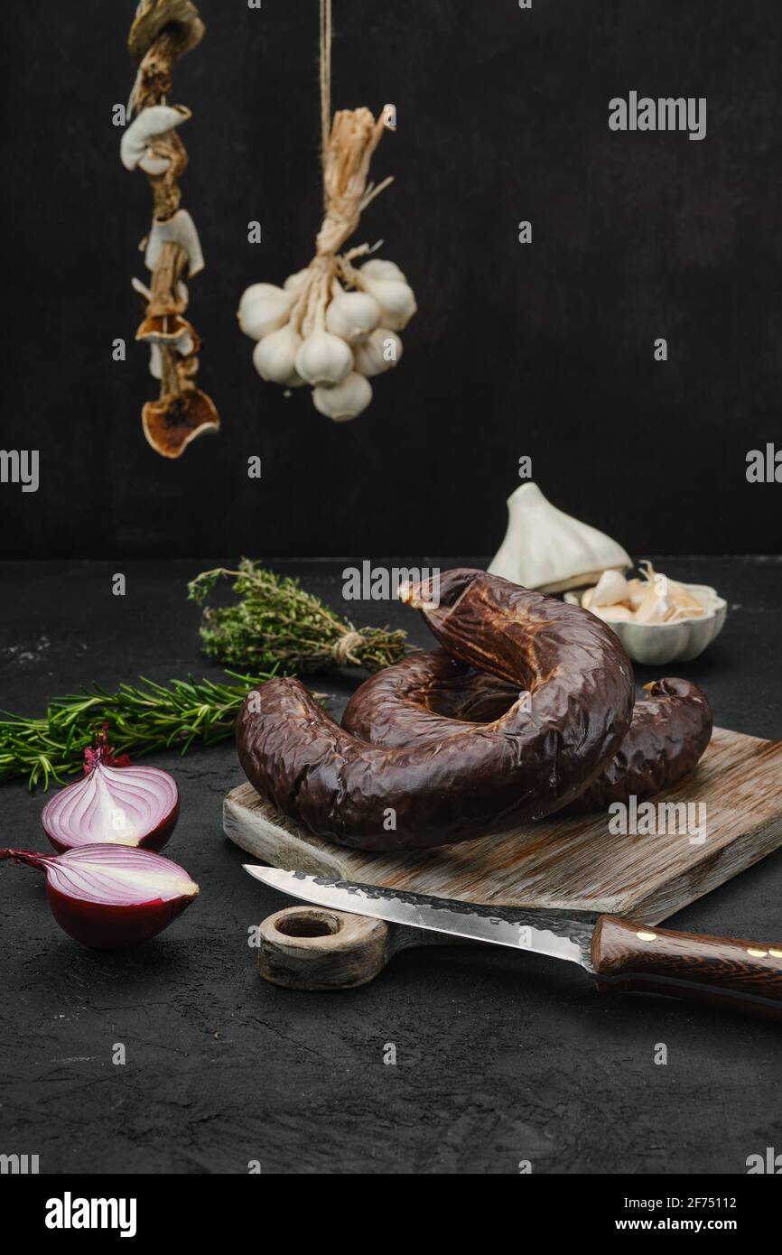 Organic blood pudding on cutting board Stock Photo - Alamy