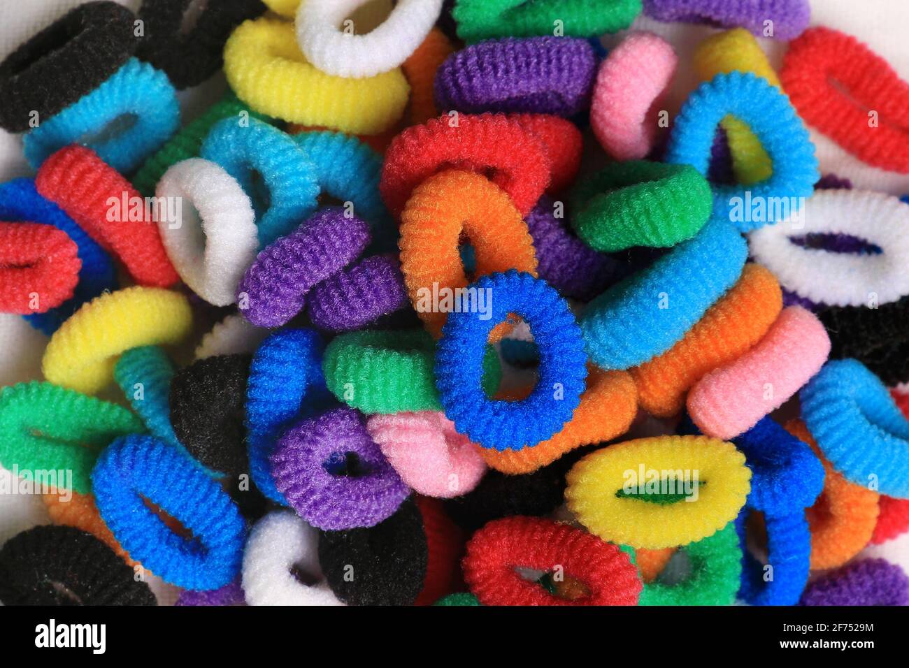 A bunch of bright colorful hair elastics Stock Photo - Alamy