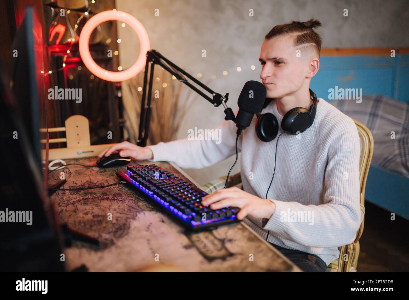 Streamer cyber performing space video game on powerful pc talking with ...