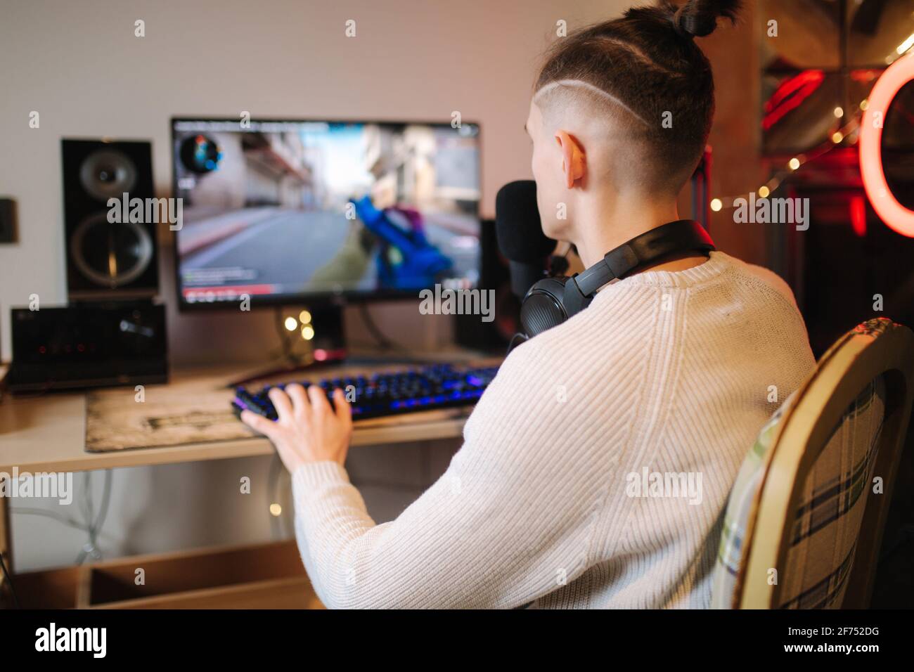 Streamer cyber performing space video game on powerful pc talking with ...