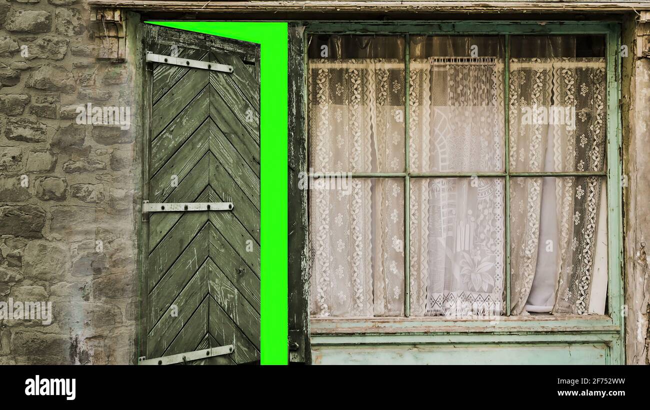 wooden door opening to green screen Stock Photo - Alamy