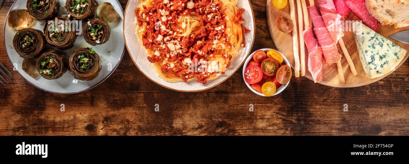Italian food panoramic background on a wooden table Stock Photo - Alamy