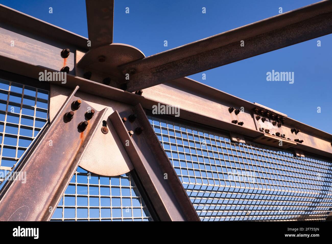 Close view of the steel profiles joints in a rusted metallic structure ...
