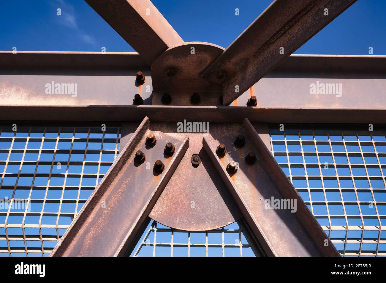 Close view of the steel profiles joints in a rusted metallic structure ...