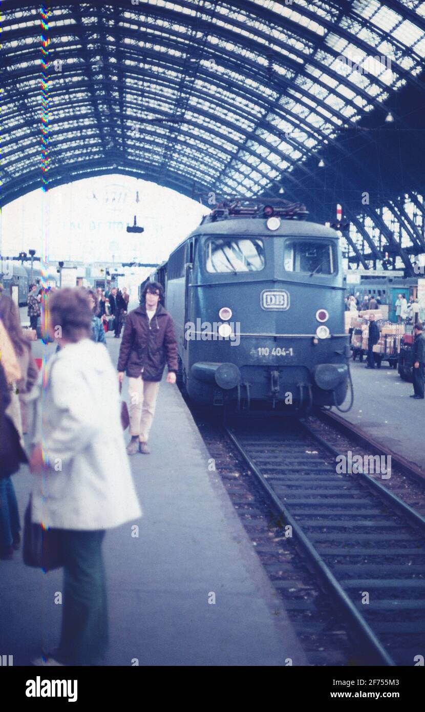 A green class 110 electric locomotive arrives at Cologne station in the ...