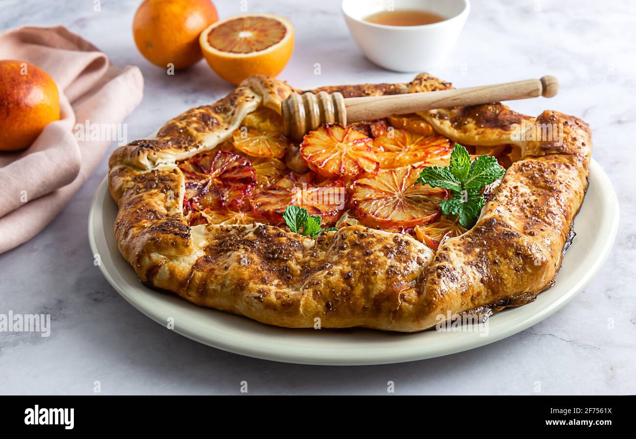 Red blood orange galette, seasonal pie with citrus. Tasty baking with ...