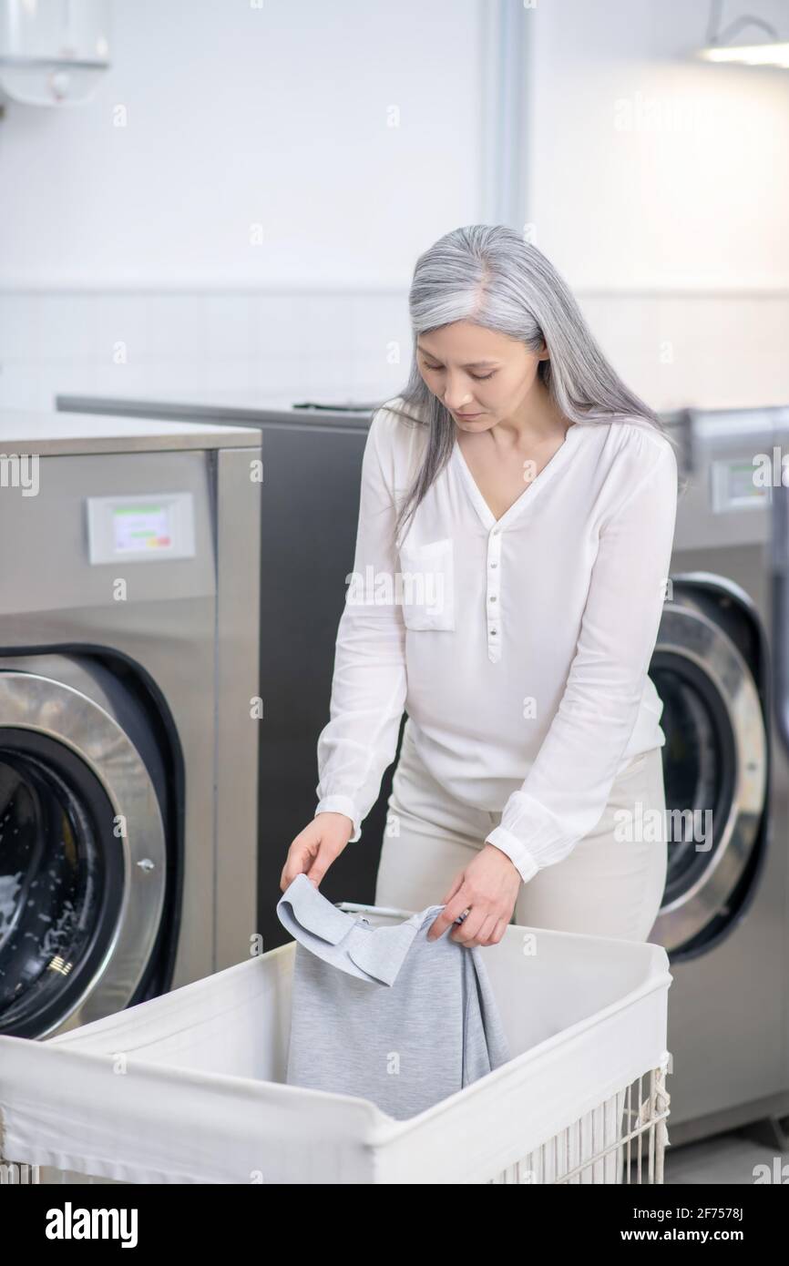 Laundry employee hi-res stock photography and images - Alamy