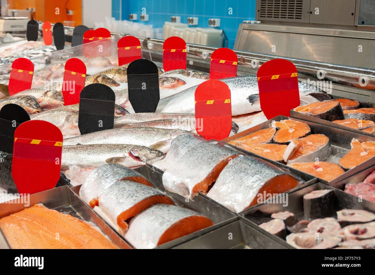 Lots of freshly caught fish in supermarket. Seafood on ice at the fish ...