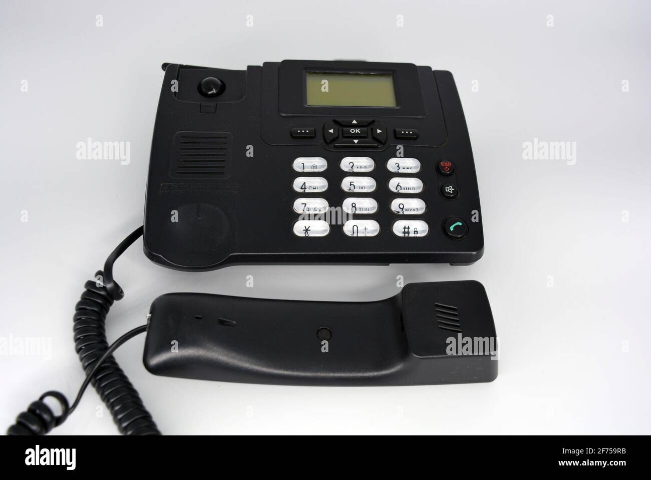 Stationary black plastic radio telephone, telephone with screen, tube ...