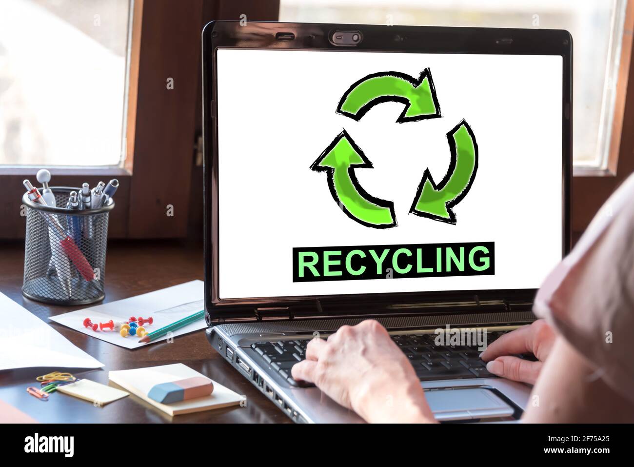 Laptop screen displaying a recycling concept Stock Photo - Alamy