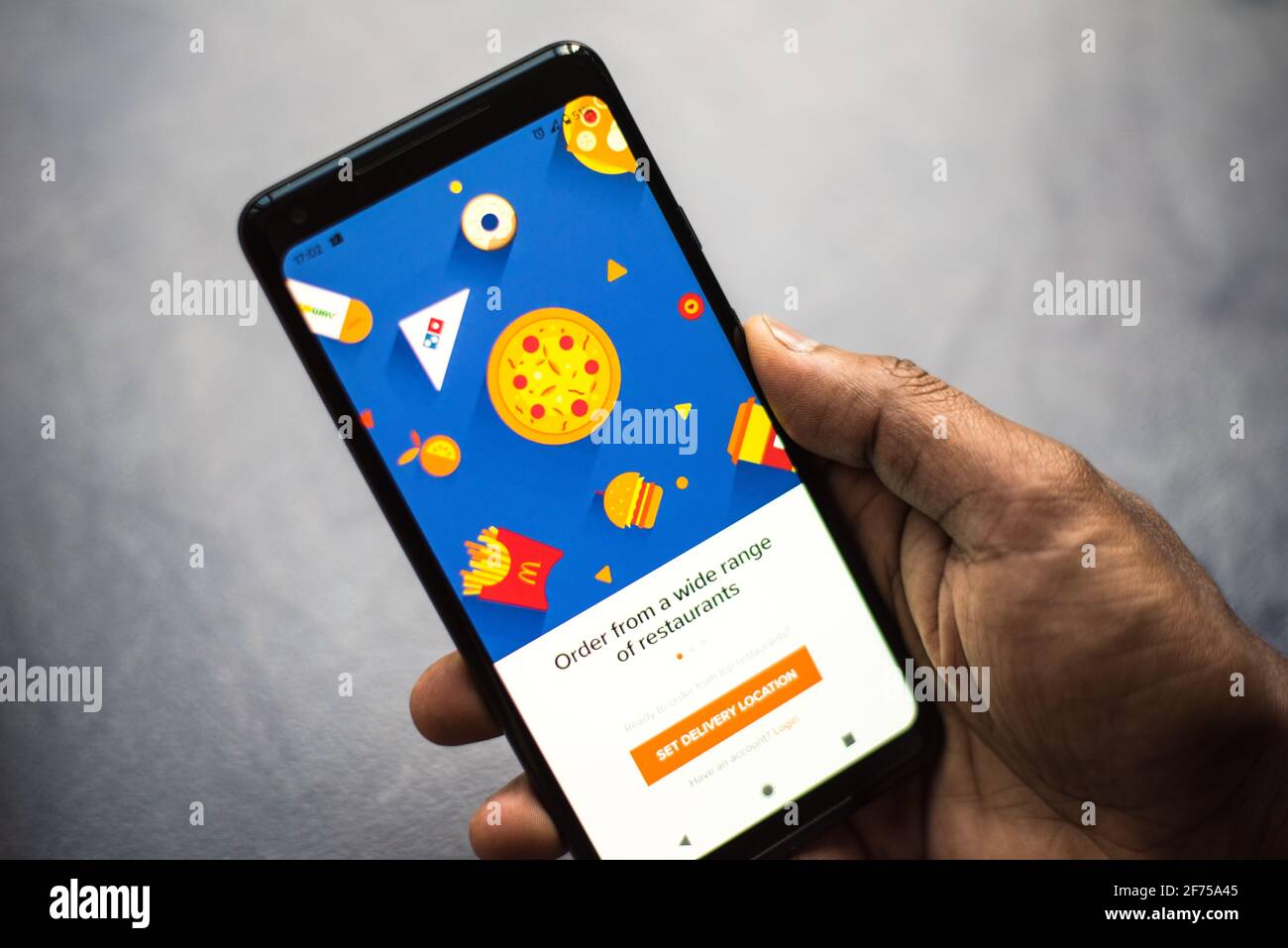 Swiggy food delivery app on smartphone held by an asian man Stock Photo ...