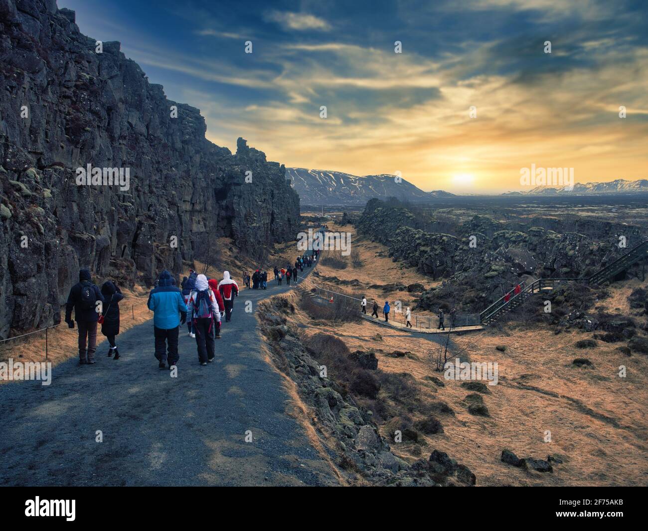Tourists walk along mountain road hi-res stock photography and images ...