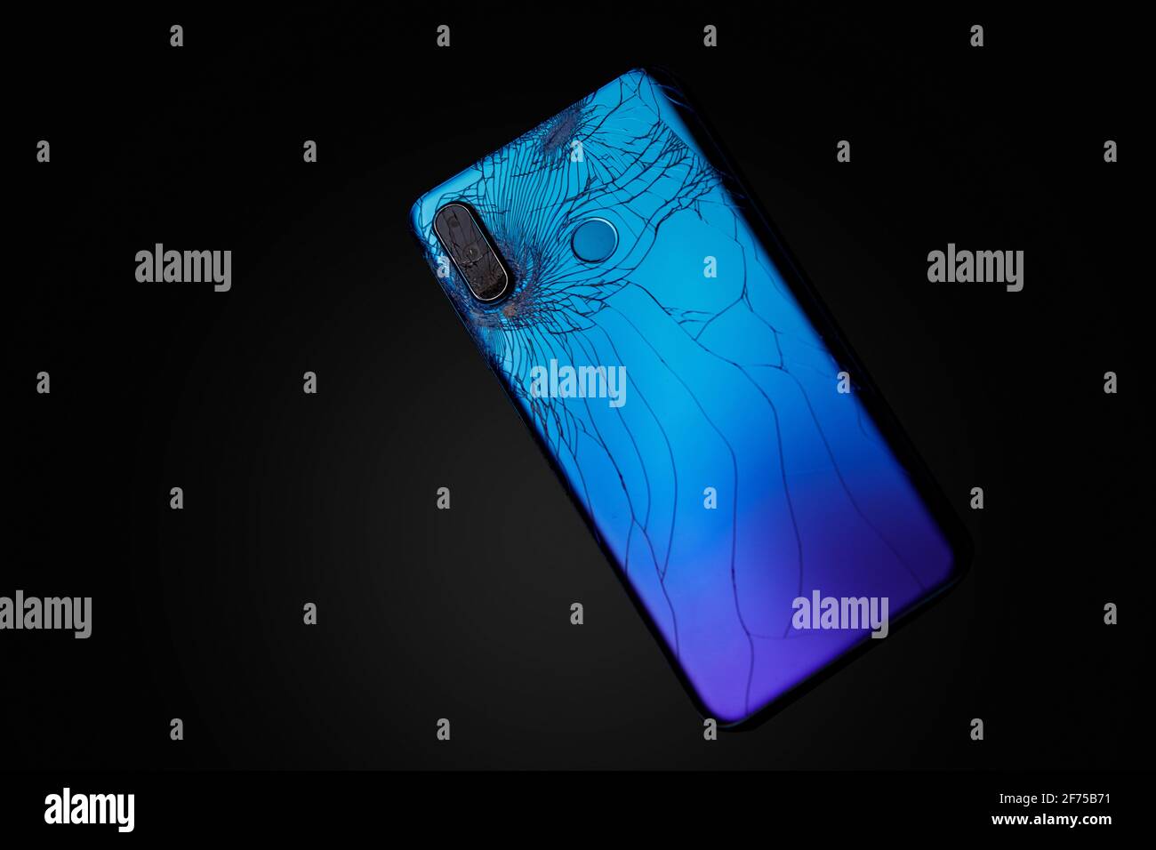 The back panel of a broken phone. Spoiled smartphone camera Stock Photo ...