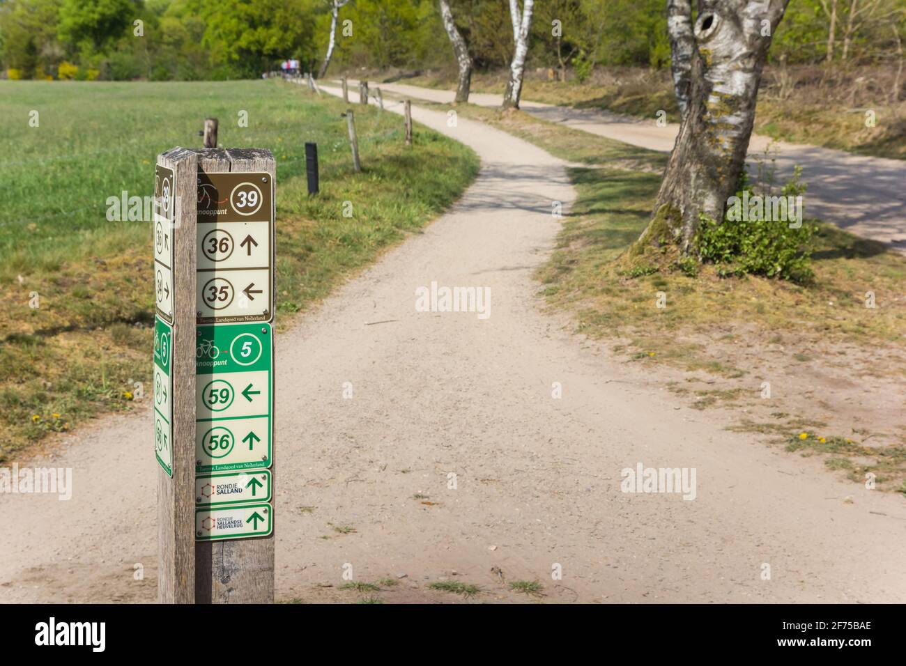 Direction sign for bicycle tracks in National Park Sallandse Heuvelrug ...