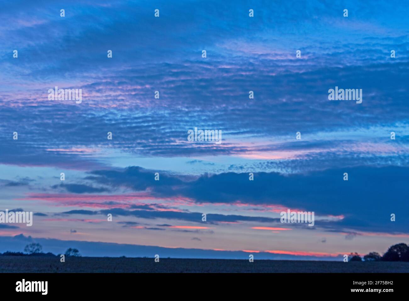 Late Autumn sunset over the Cotswolds, one of the thirty-four allocated ...