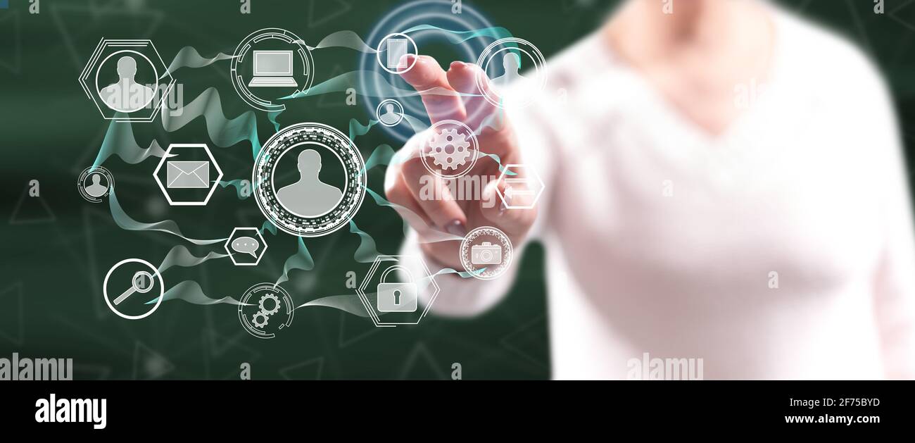 Woman touching a social network concept on a touch screen with her ...