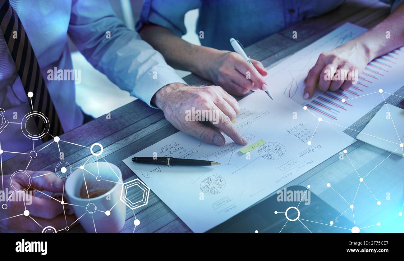 Two business people working together in office; light effect Stock ...