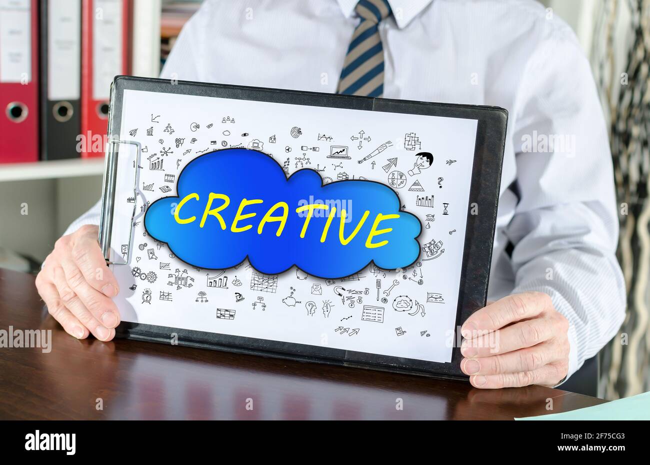 Creativity concept shown by a businessman Stock Photo - Alamy