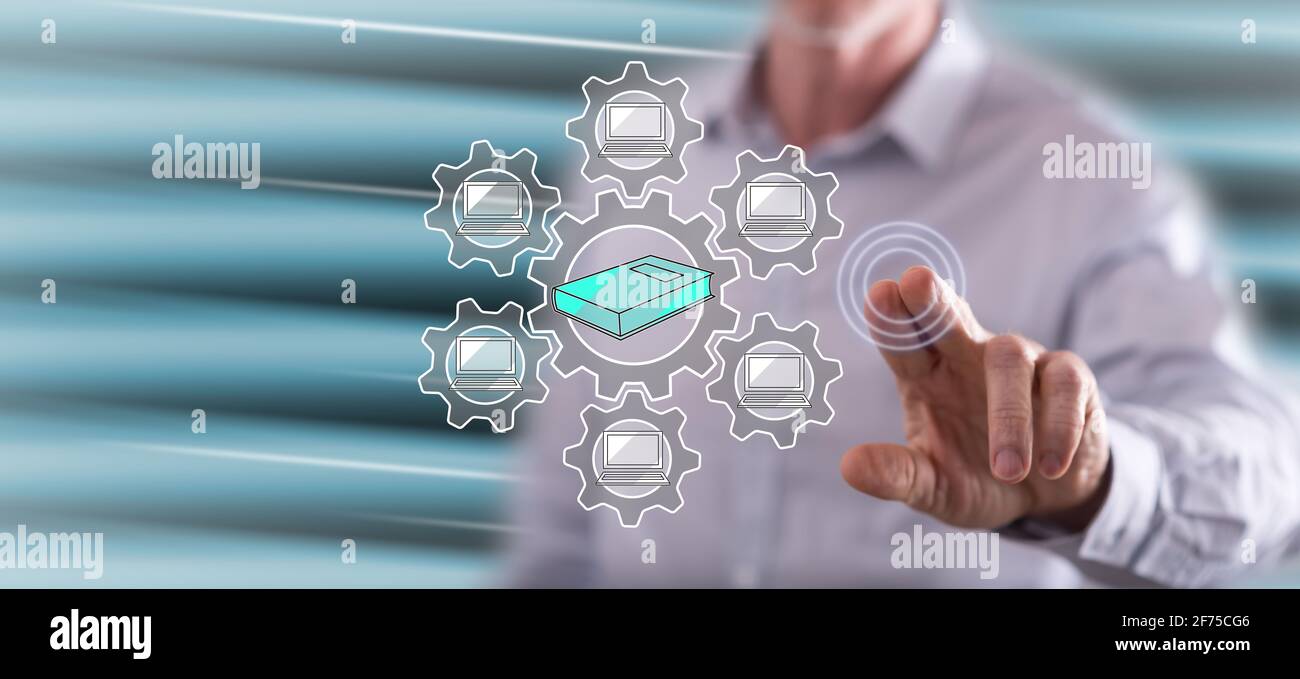 Man touching an e-learning concept on a touch screen with his finger ...